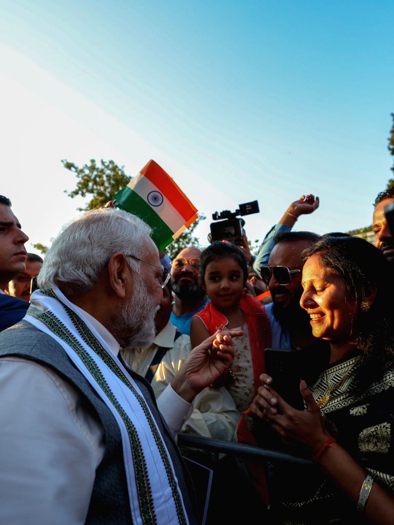Prime Minister Narendra Modi being welcomed by people of the Indian ...