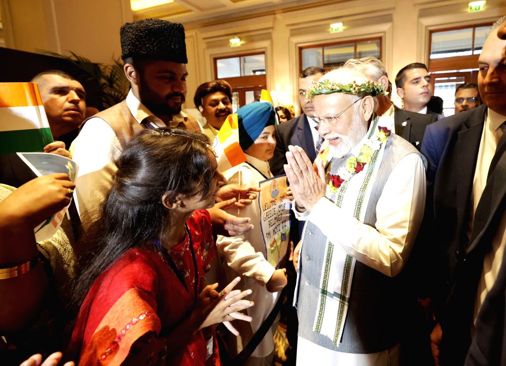 Prime Minister Narendra Modi being welcomed by people of the Indian ...