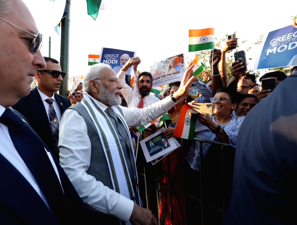 Prime Minister Narendra Modi being welcomed by people of the Indian ...