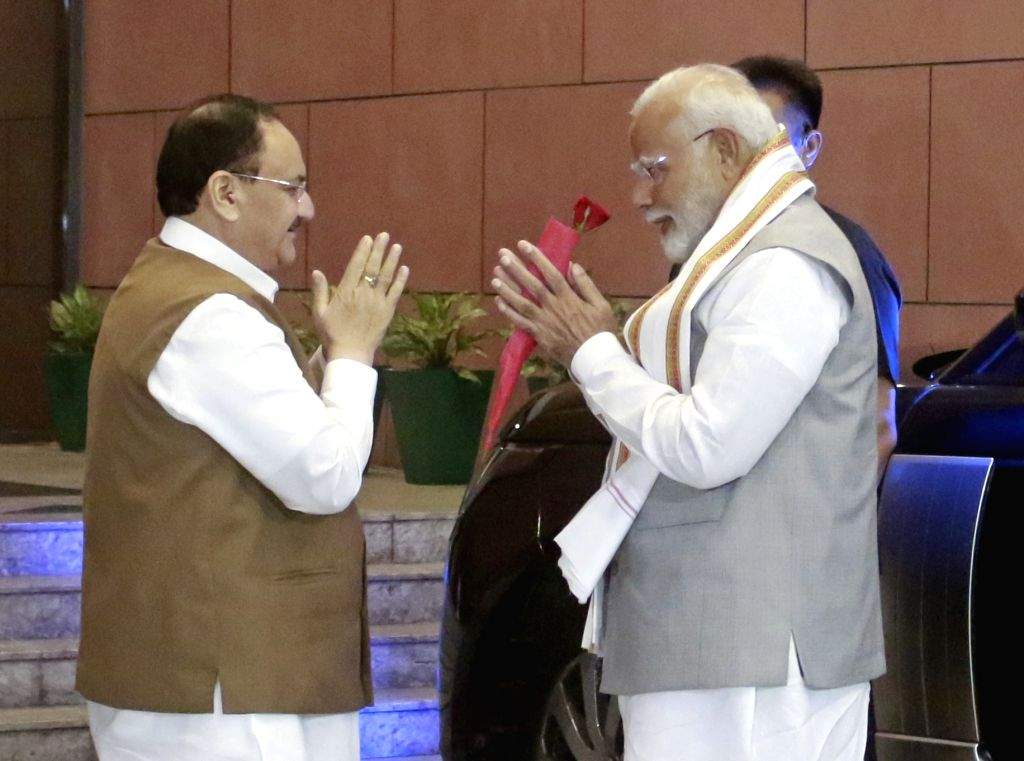 Prime Minister Narendra Modi being welcomed by BJP National President ...