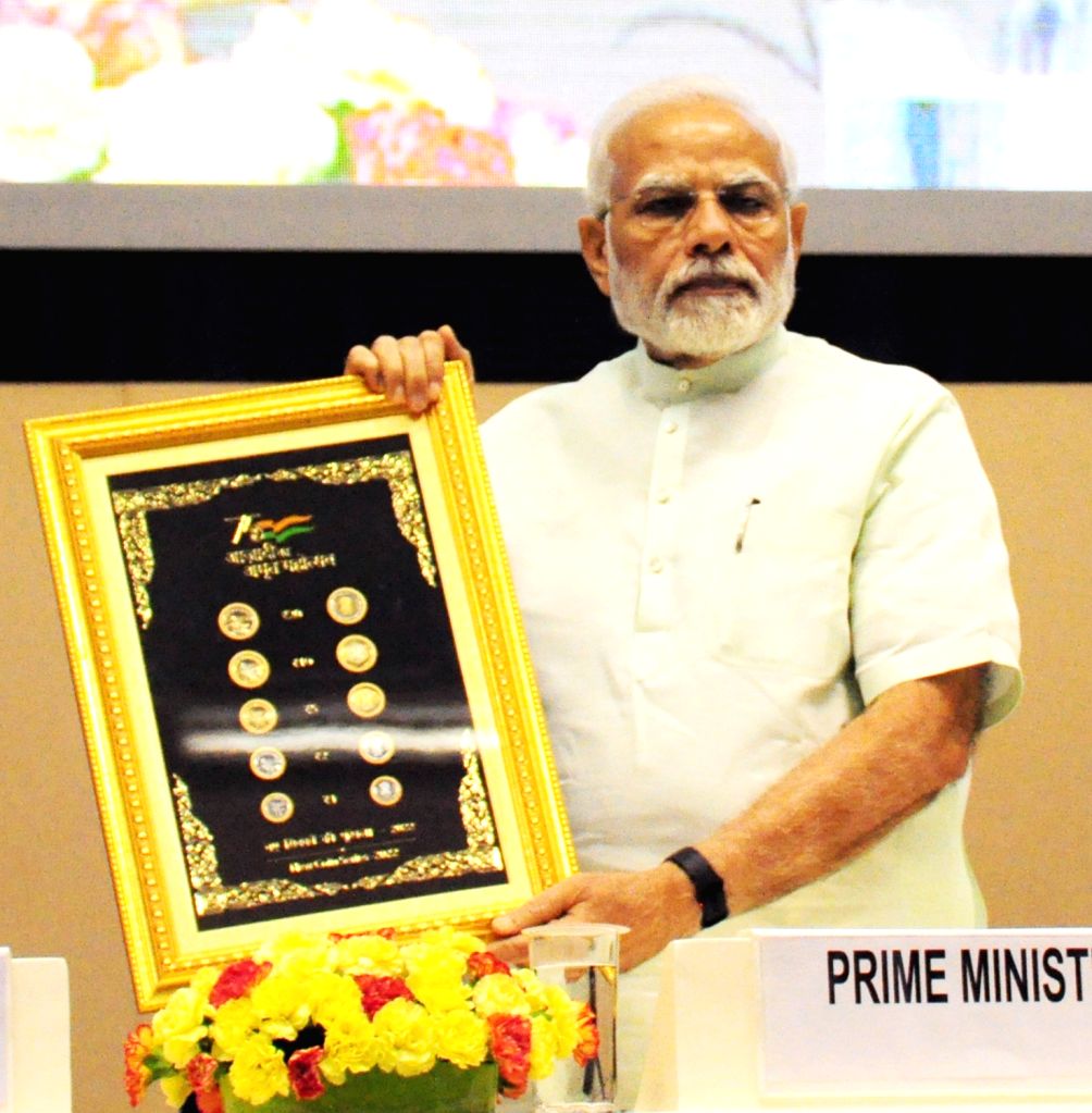 Prime Minister Narendra Modi dedicates new coins