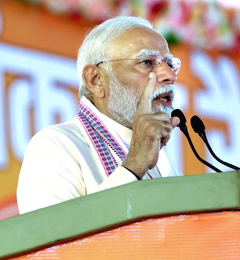 Prime Minister Narendra Modi during a public meeting for Lok Sabha ...