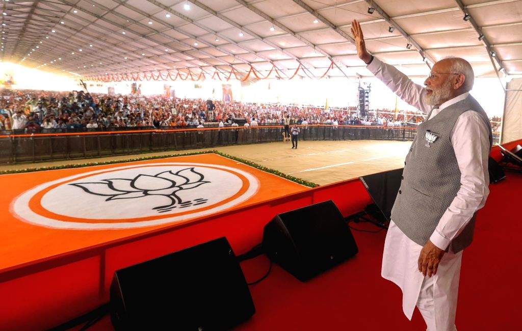 Prime Minister Narendra Modi during a public meeting for Lok Sabha ...