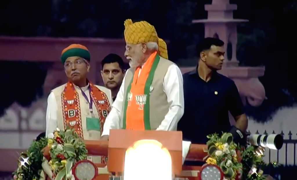 Prime Minister Narendra Modi during a road show ahead of Rajasthan ...