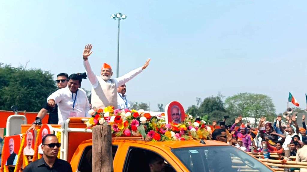 Prime Minister Narendra Modi during a road show, at Krishnanagar in ...