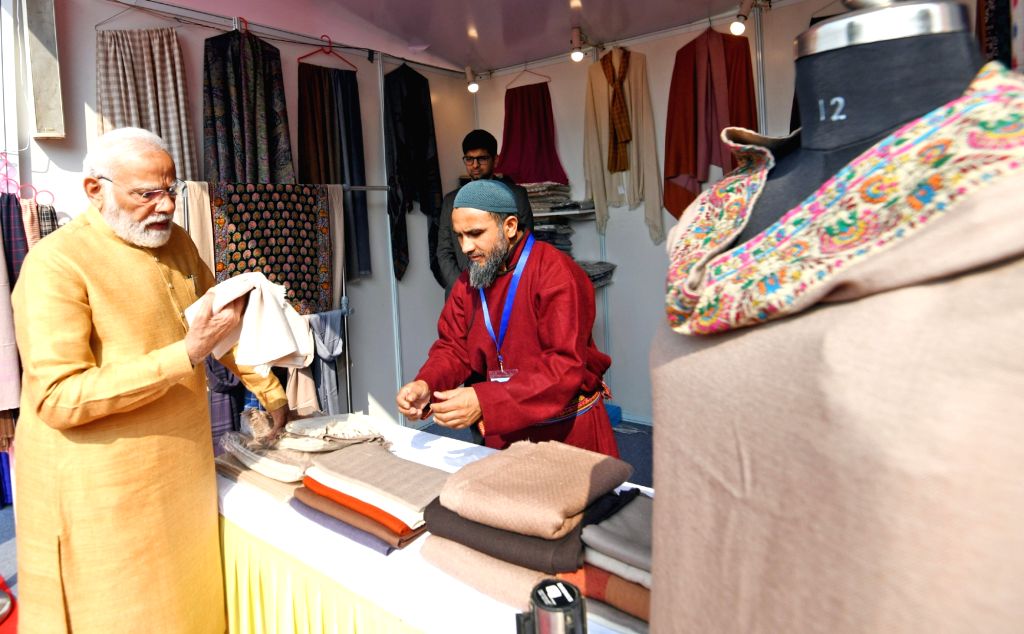 Prime Minister Narendra Modi interacts with tribal artisans
