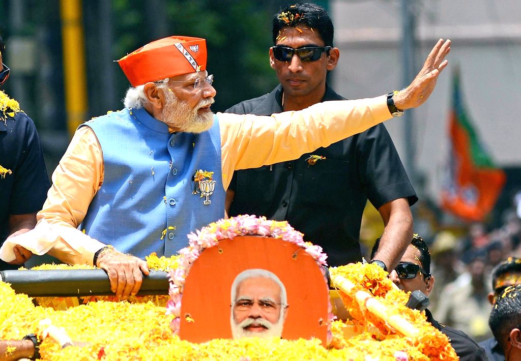 Prime Minister Narendra Modi waves at supporters and party workers ...