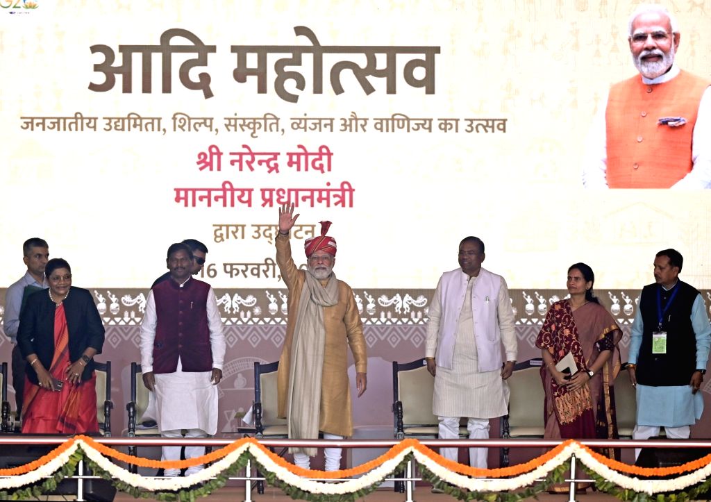 PM Modi waves during theNational Aadi Mahotsav 2023