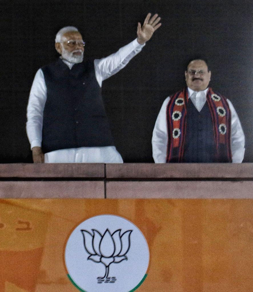:New Delhi:Prime Minister Narendra Modi waves to BJP workers.