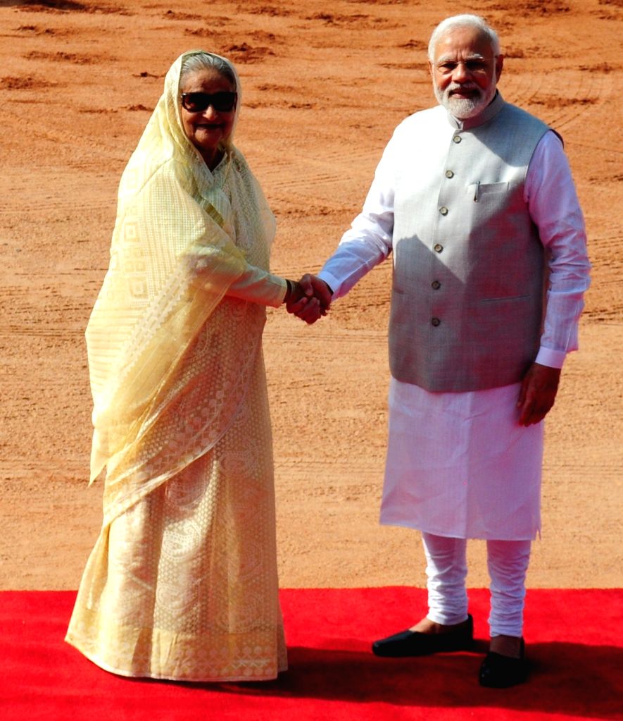 Prime Minister Narendra Modi welcomes his Bangladeshi counterpart ...