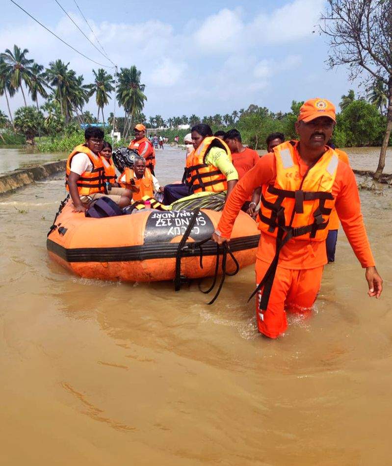 NDRF personnel conduct relief and rescue operations in areas affected ...