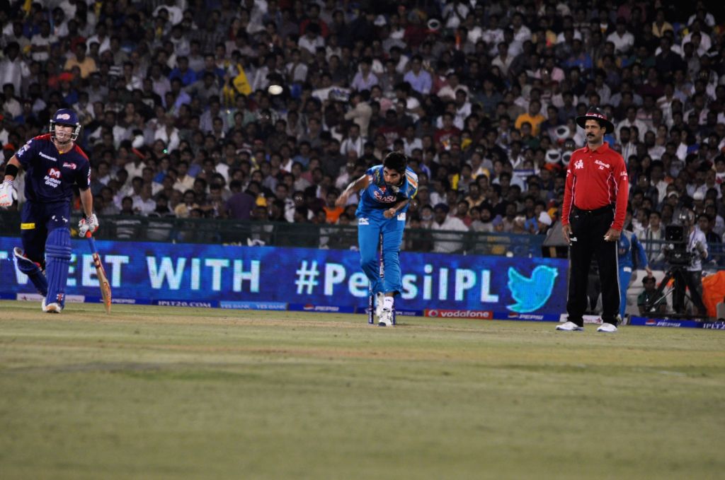 Pune Warriors India bowler in action during the match between Delhi ...