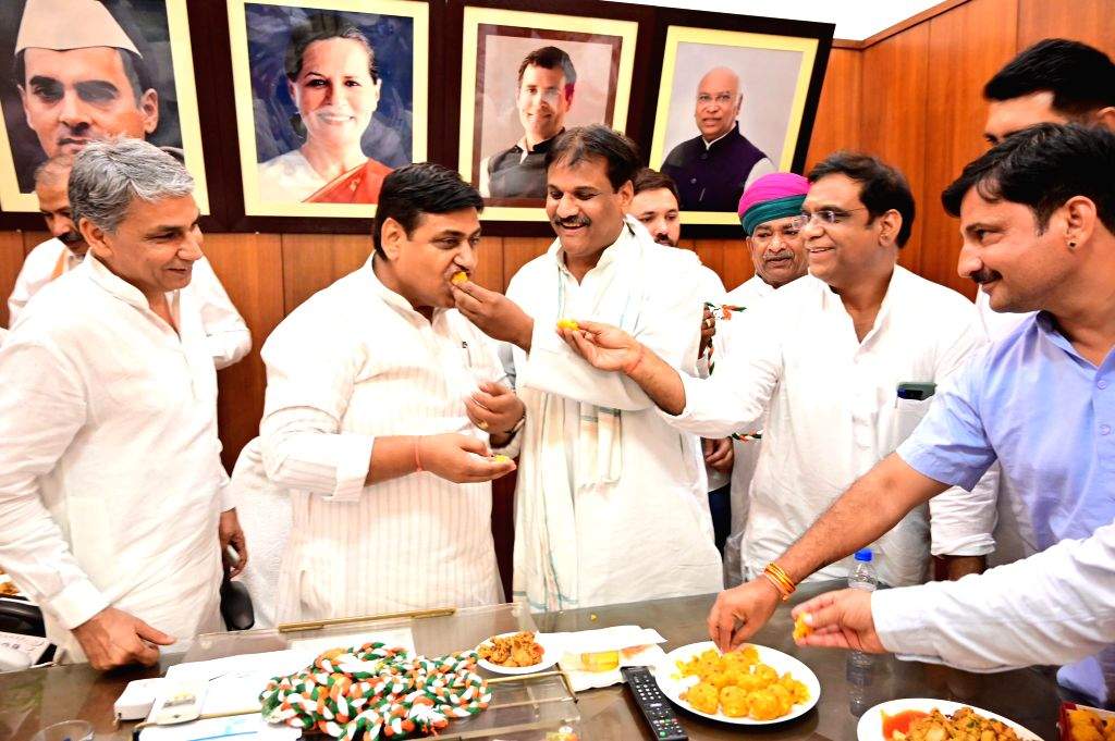 Rajasthan Congress chief Govind Singh Dotasra with party leader ...
