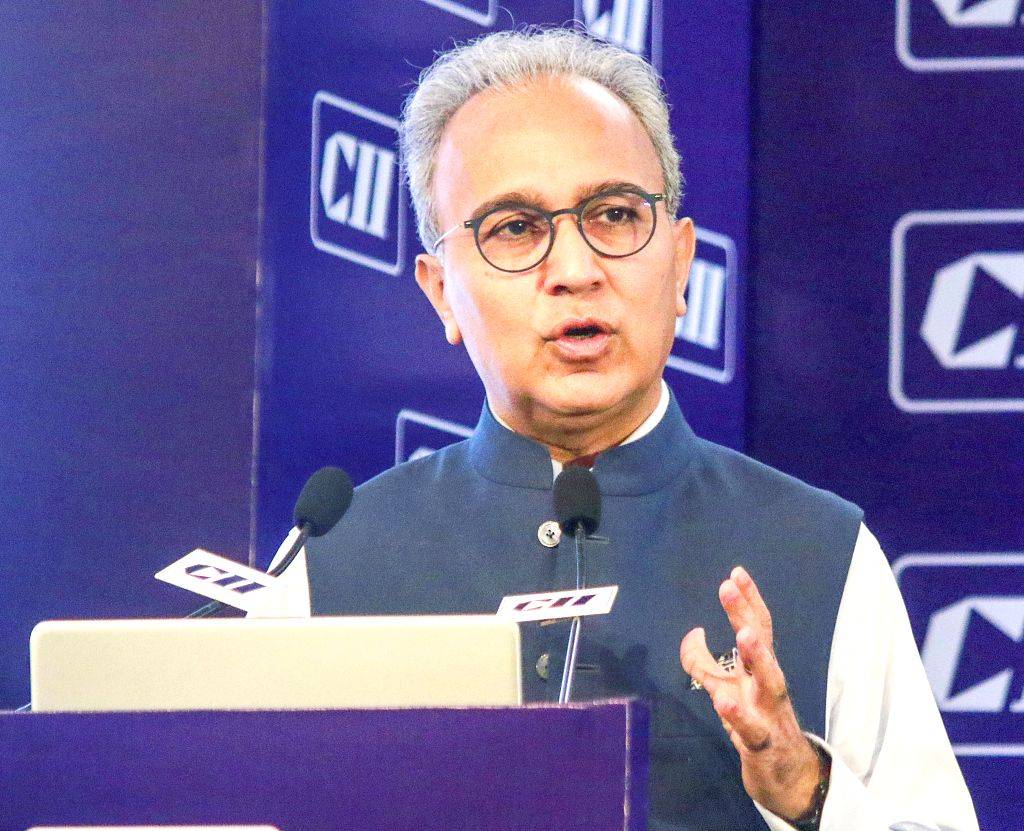 Rajiv Memani addresses a press conference