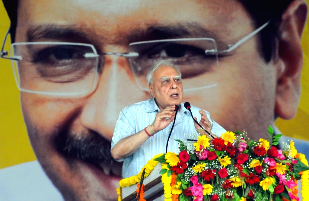 Rajya Sabha MP Kapil Sibal addresses during the AAP's 'maha rally