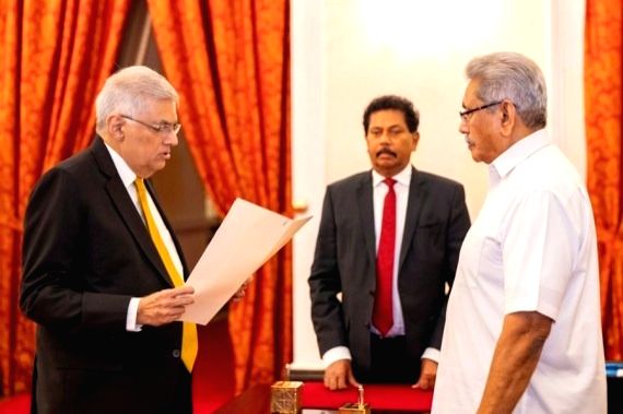 Sri Lanka:Ranil Wickremesinghe (L front) is sworn in as the prime ...