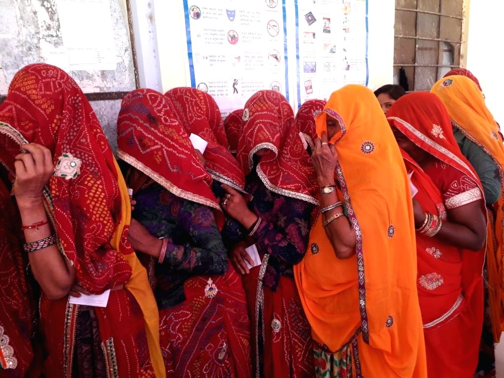 Ranwal (Rajasthan): Women queue up to cast vote during the fifth phase ...