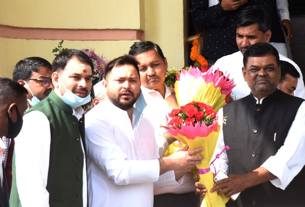 RJD leader Tejashwi Yadav being welcomed by party's legislators