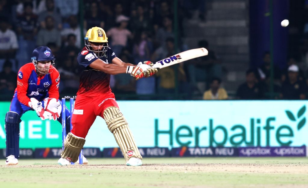 RCB's batsman Mahipal Lomror plays a shot