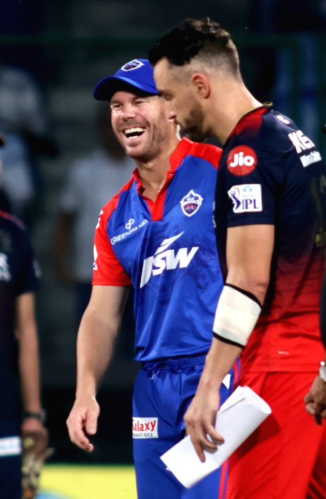 RCB's captain Faf du Plessis and DC's captain David Warner during the toss
