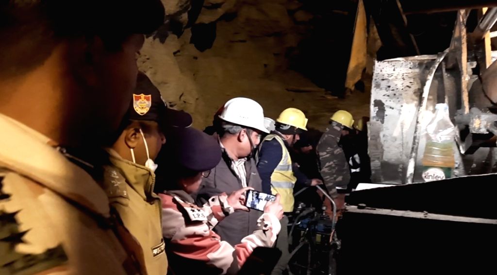 Rescuers drilling tunnel to save trapped people