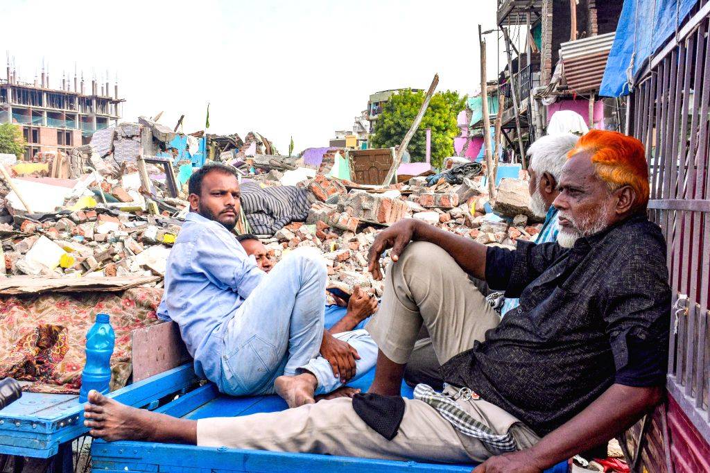 Residents Amid Rubble After Demolition in Nashir Nagar