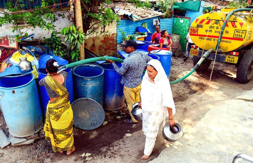 Residents Collect Water Amid Supply Crisis