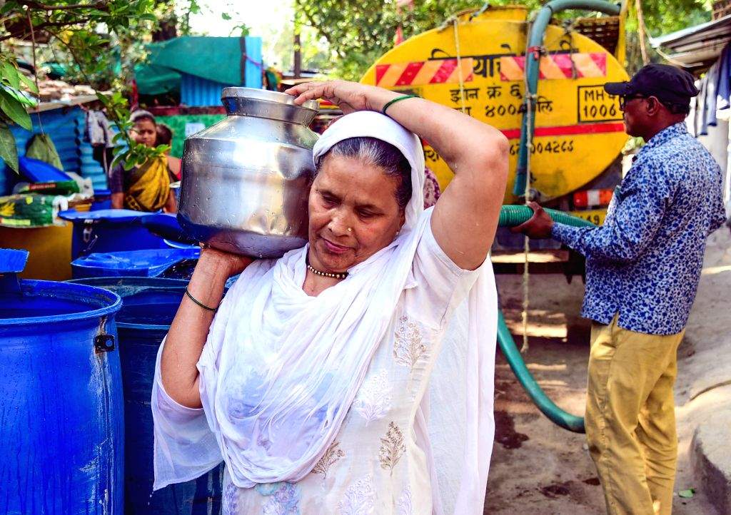 Residents Collect Water Amid Supply Crisis