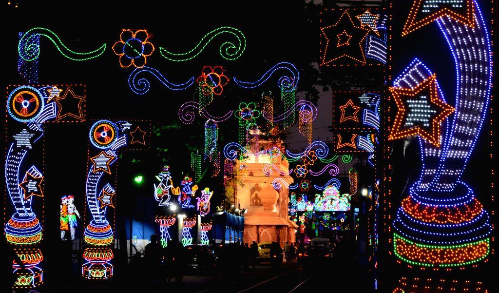 Roads are illuminated with lights on the occasion of Kali Puja