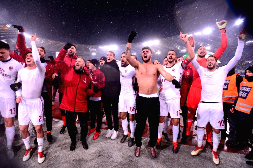 AC Milan's players celebrate after winning the second-leg semifinal ...