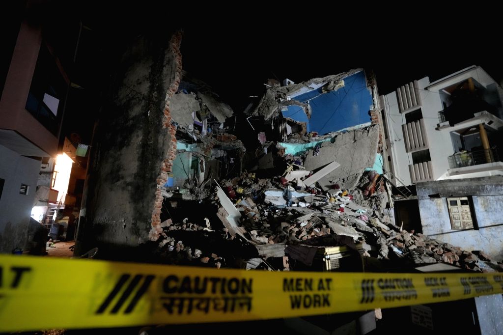 : Ahmedabad : Rubble of a three-storey building after its collapse