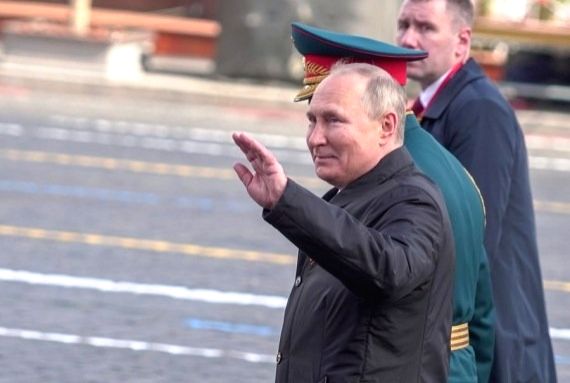 Russian President Vladimir Putin (front) passes by after the Victory ...