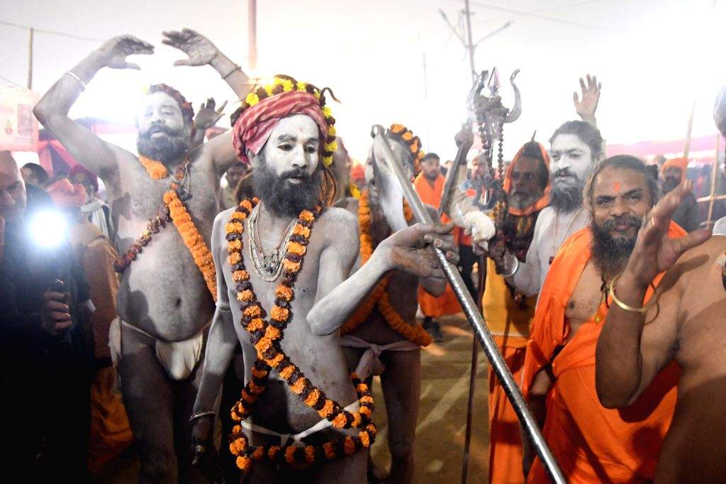 Sadhus at their camp before taking part in the religious procession ...