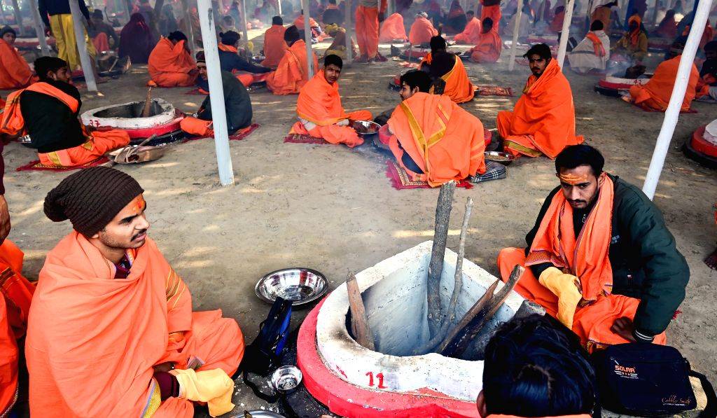 Sadhus (Holy Men) perform rituals at the Triveni Sangam