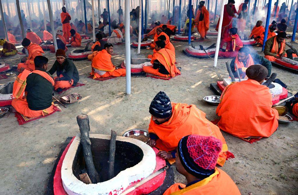 Sadhus (Holy Men) perform rituals at the Triveni Sangam