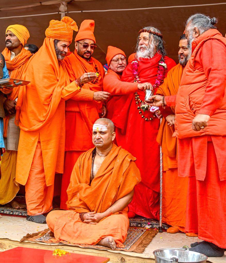 Sadhus' of the 'Mahanirvani Akhara' perform the 'pattabhishek' ritual ...