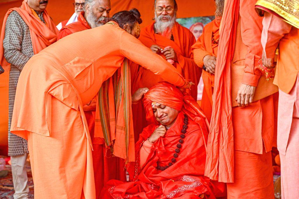 Sadhus' of the 'Mahanirvani Akhara' perform the 'pattabhishek' ritual ...