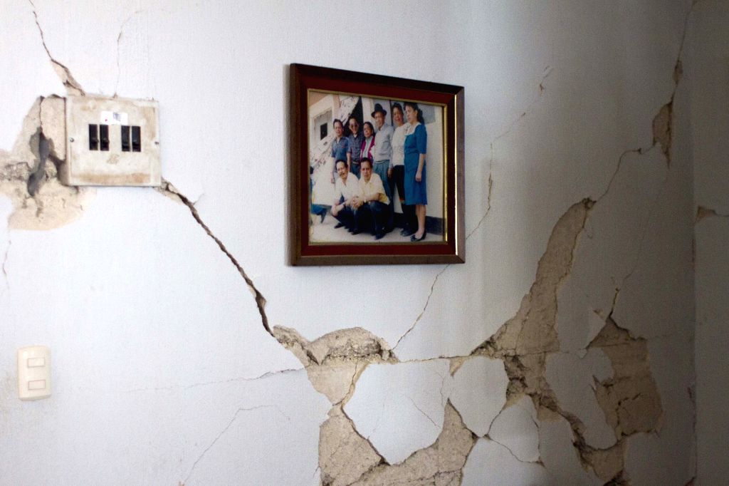 Facade of a building is damaged by an earthquake, in San Pedro Sacatepequez