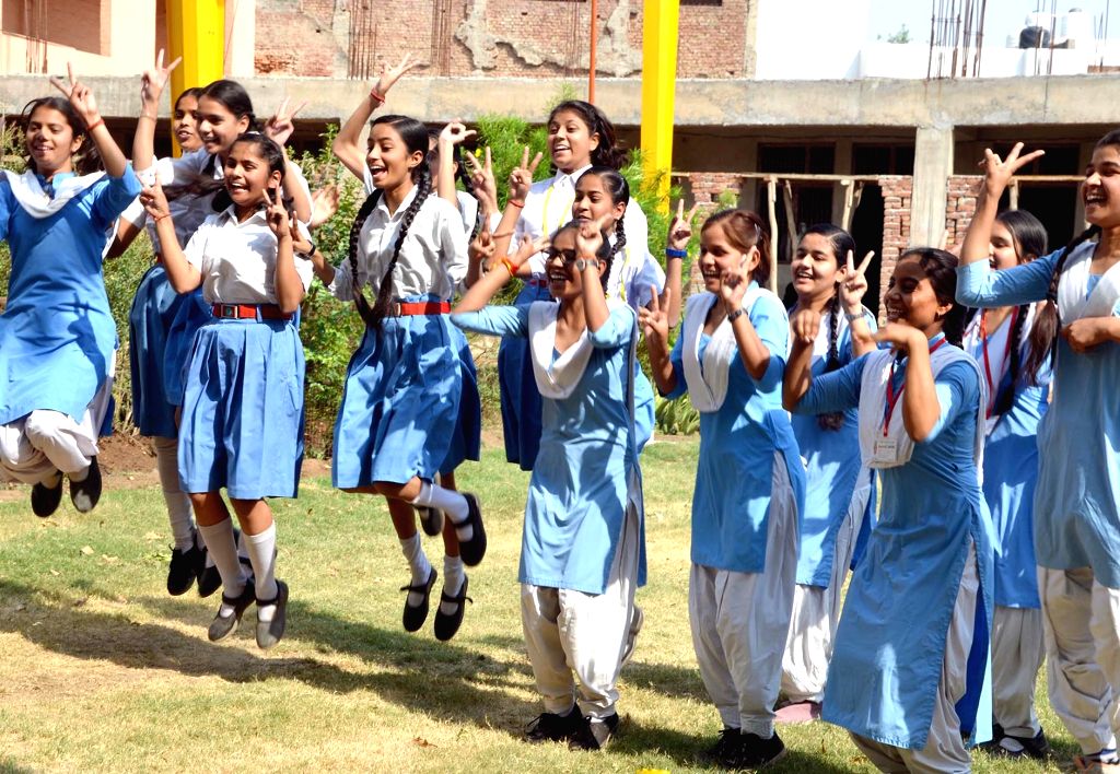 School girls celebrate their success after the UP Board declared 10th ...
