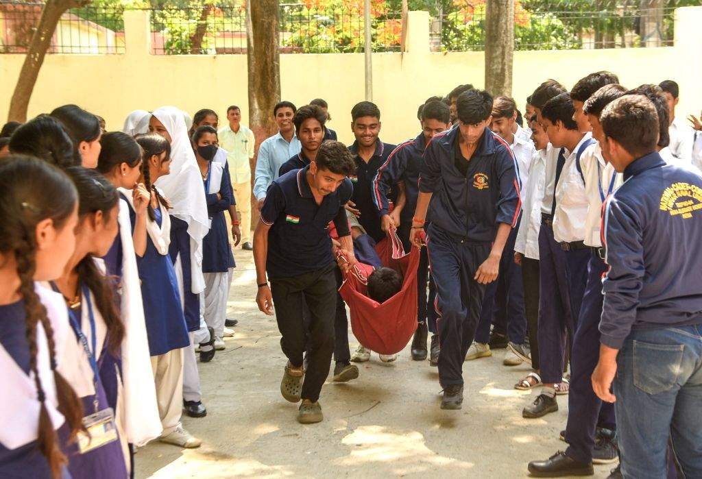 School students participate in a civil defence mock dril