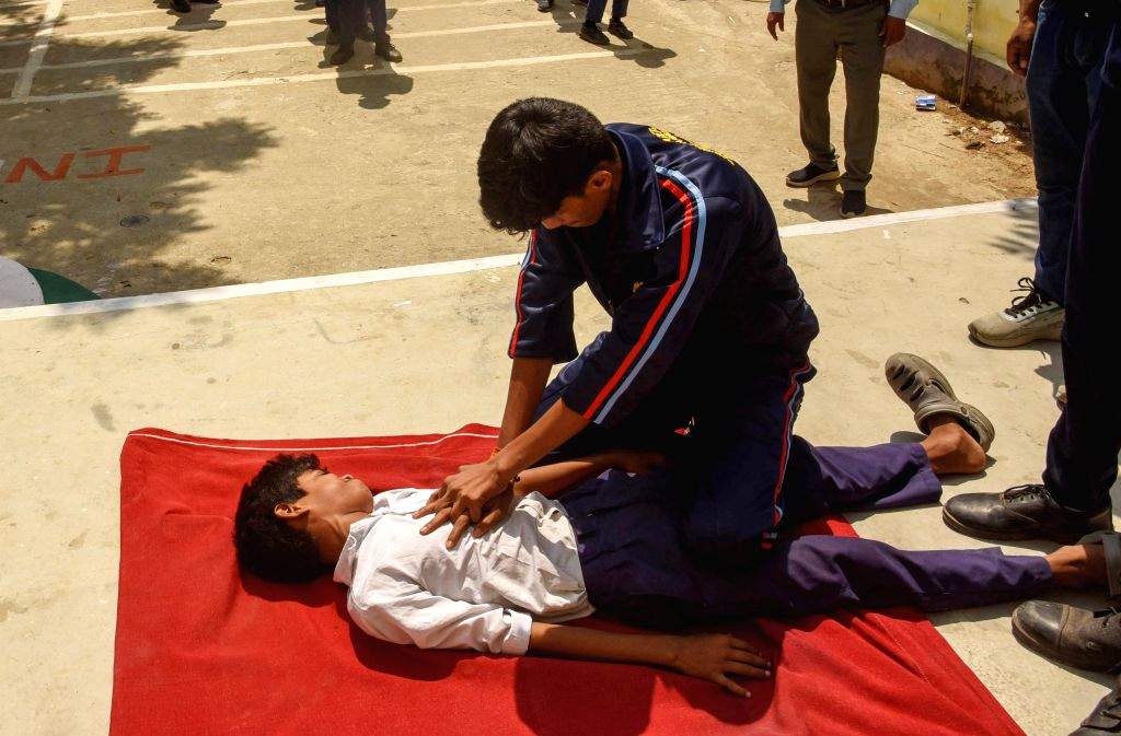 School students participate in a civil defence mock dril