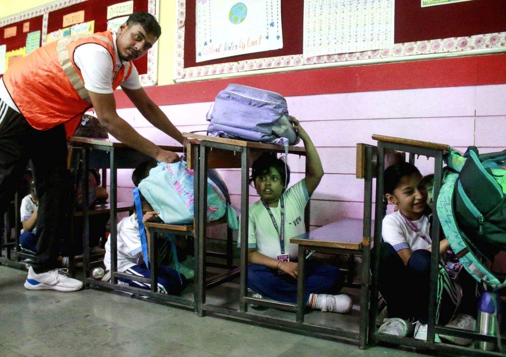 School students participate in a civil defence mock dril