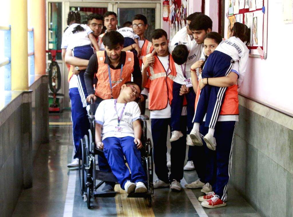 School students participate in a civil defence mock dril