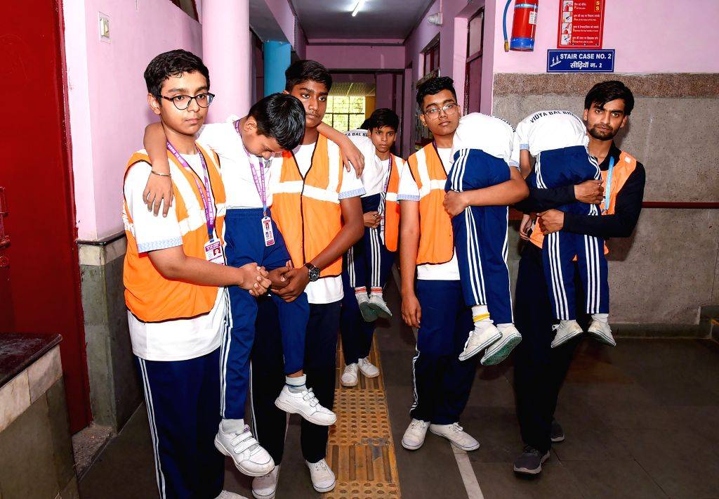 School students participate in a civil defence mock dril