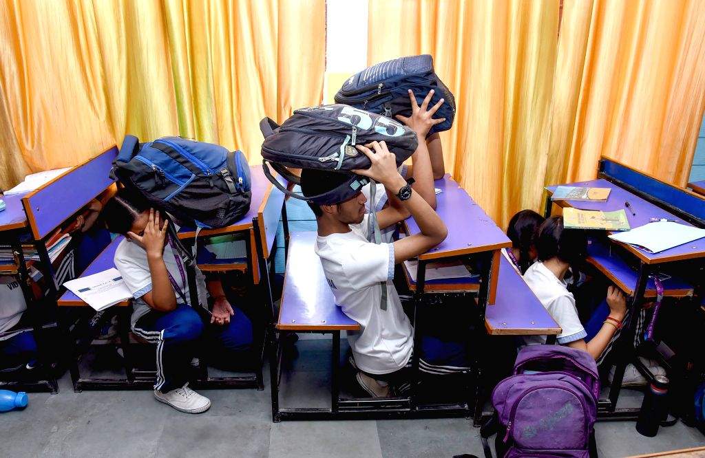 School students participate in a civil defence mock dril