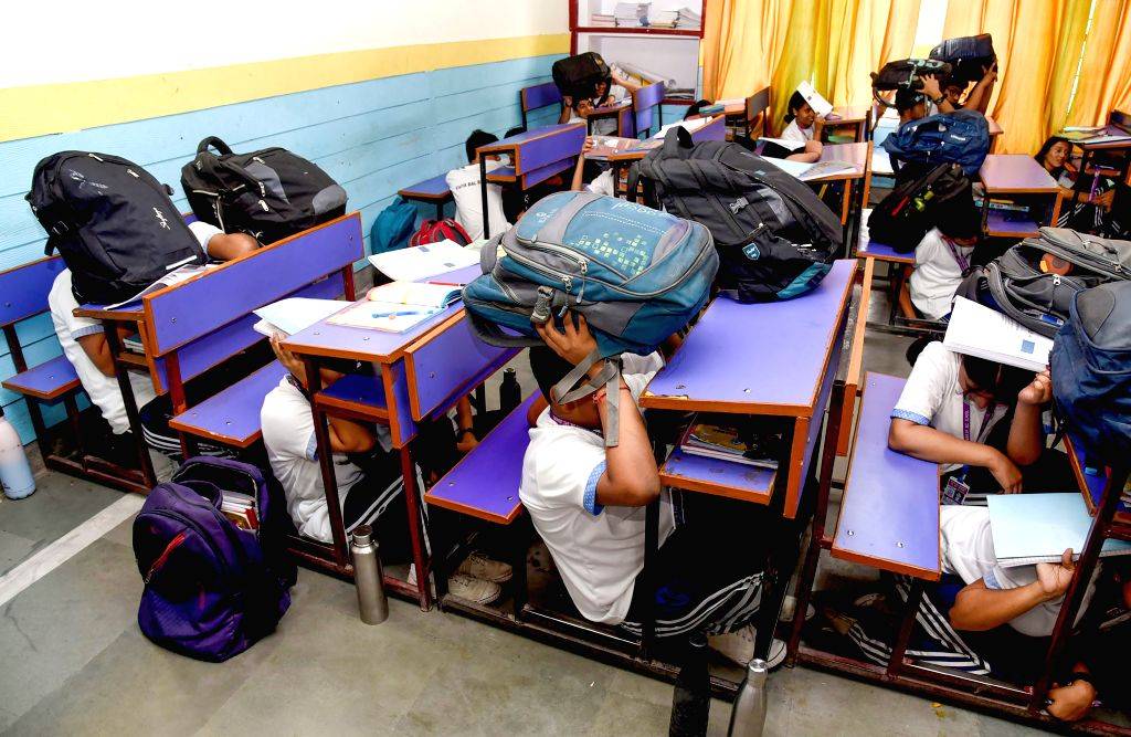 School students participate in a civil defence mock dril