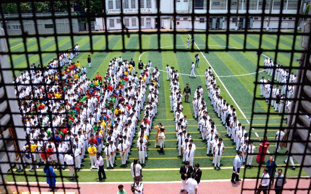 School students participate in a civil defence mock drill
