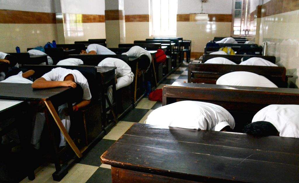 School students participate in a civil defence mock drill
