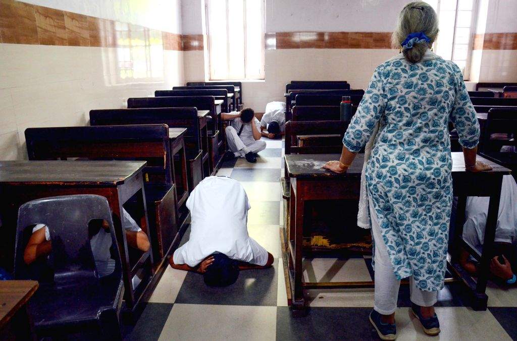School students participate in a civil defence mock drill