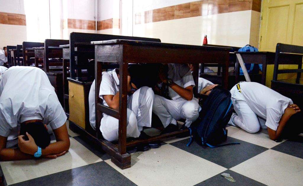 School students participate in a civil defence mock drill